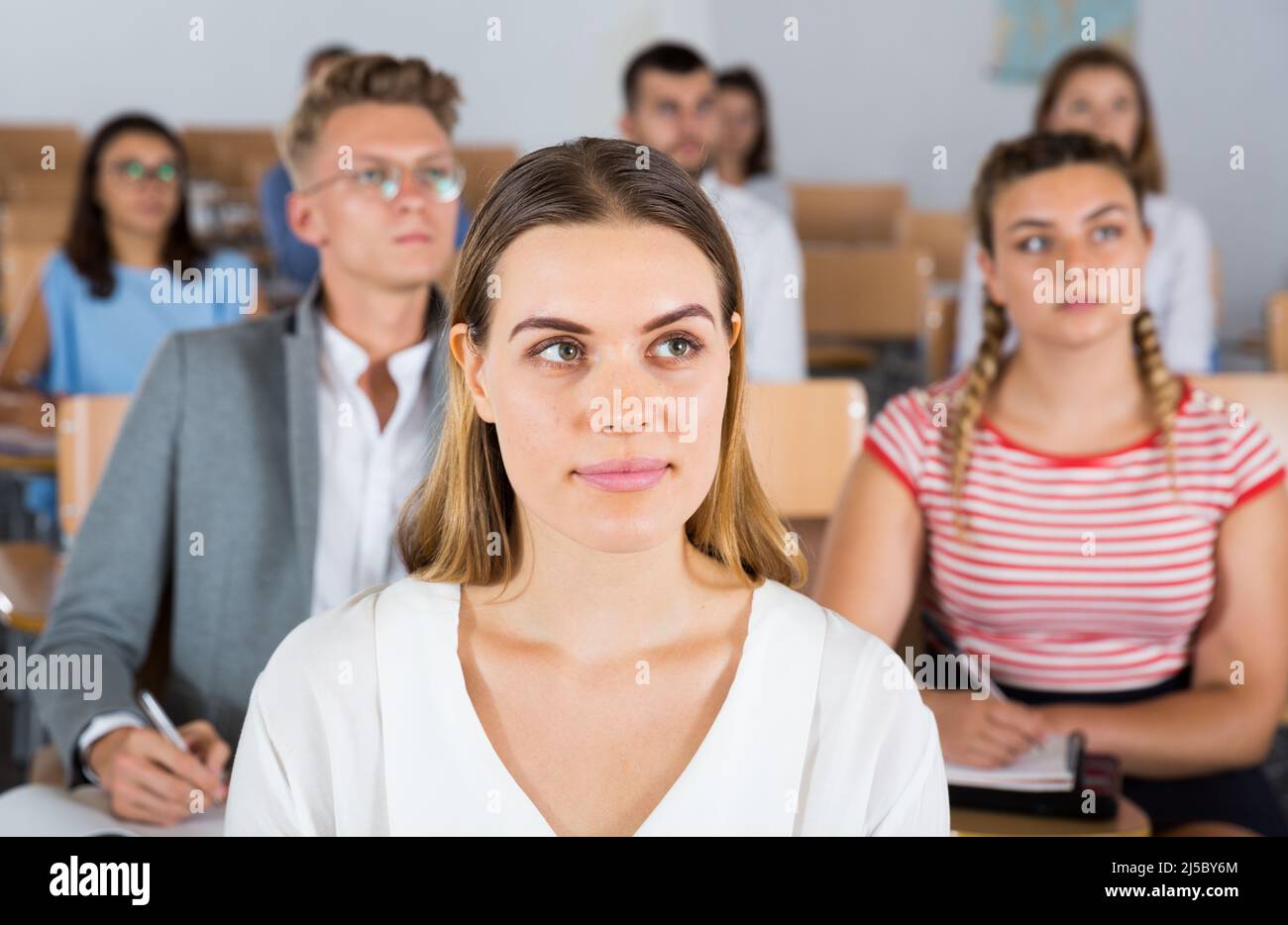 Woman lecturing to men hi-res stock photography and images - Alamy