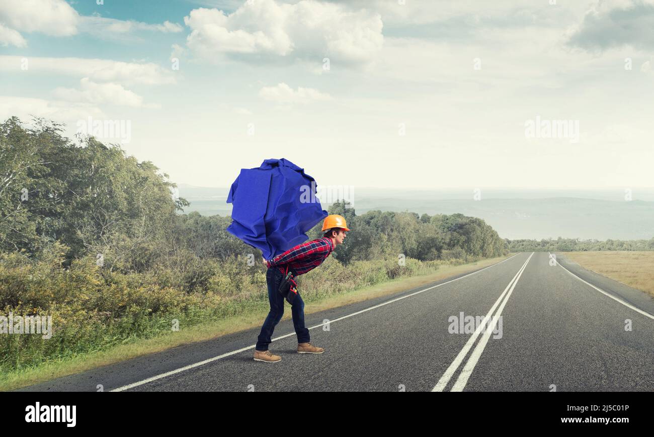 Engineer man carry load Stock Photo - Alamy