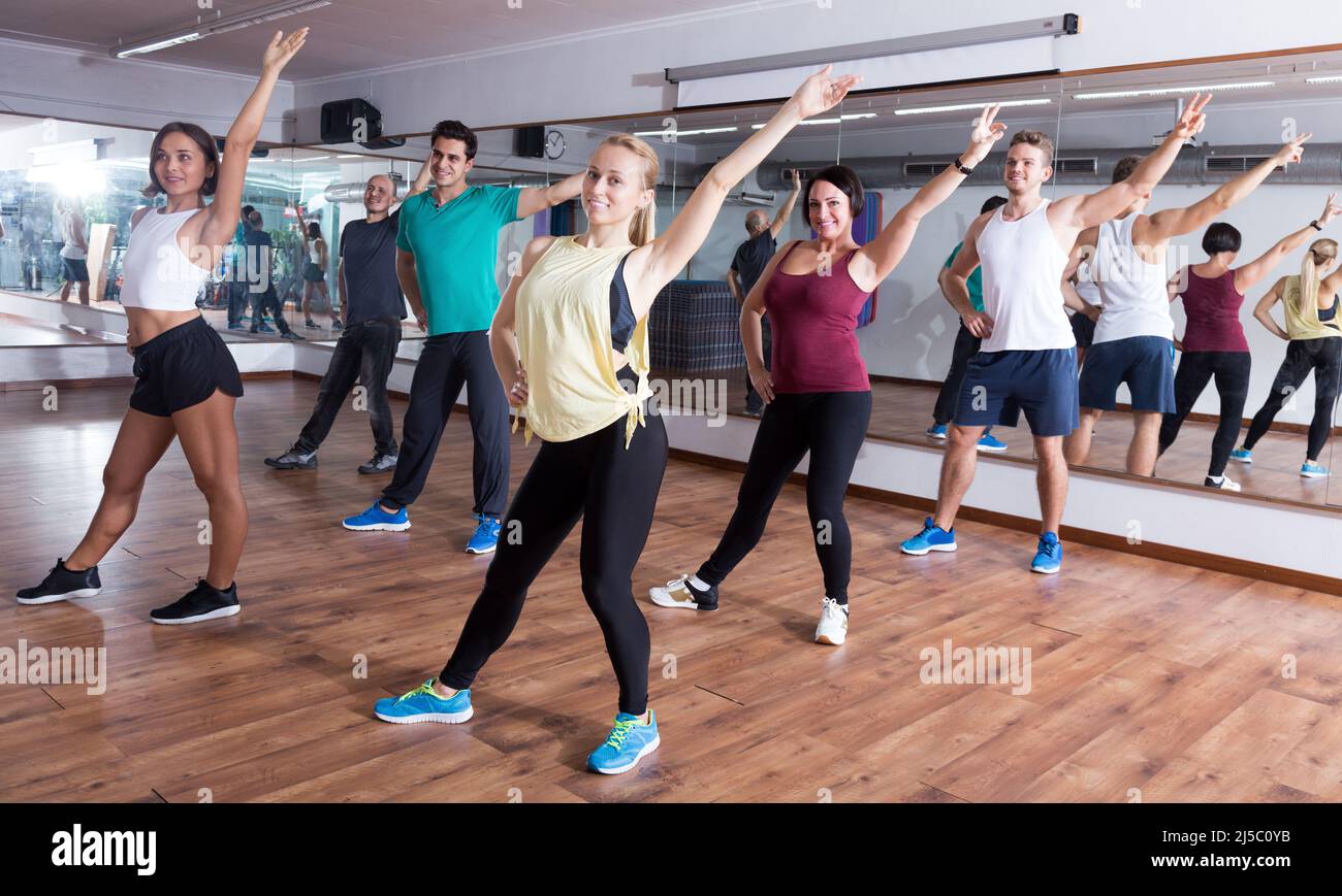 Happy people exercising zumba elements together Stock Photo - Alamy