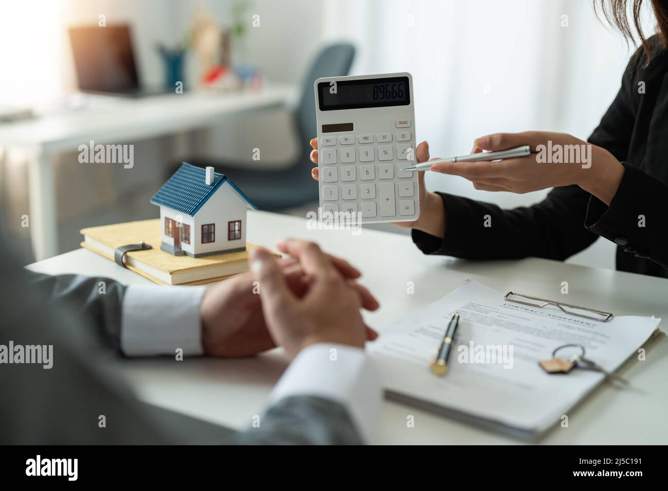 Real estate agent showing financial rate home loan for sign agreement ...