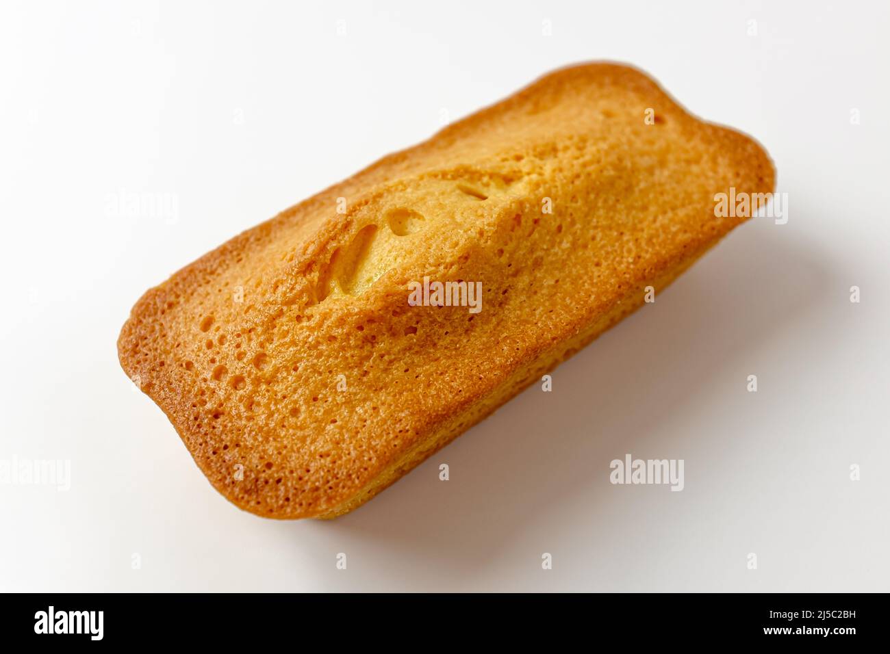 Financier on a white background Stock Photo - Alamy