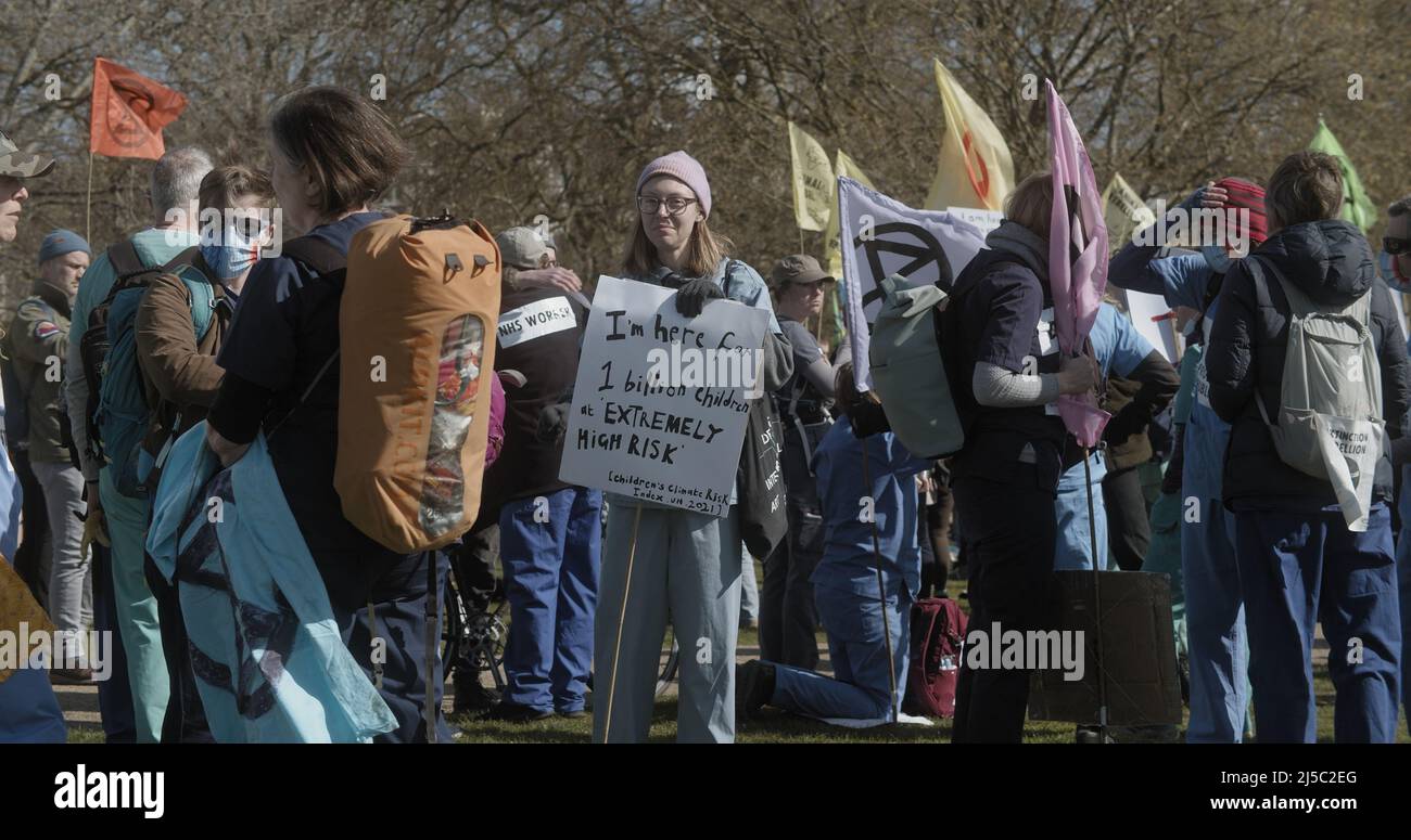 London, UK - 04 09 2022: A female doctor climate protester holding a ...