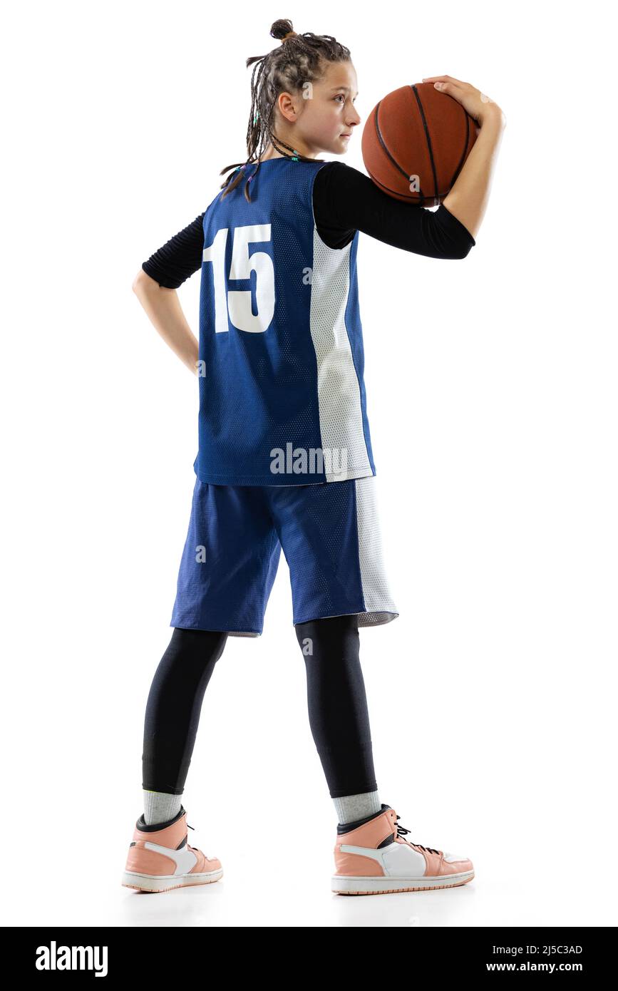 Side view portrait of young girl in blue uniform, basketball player ...
