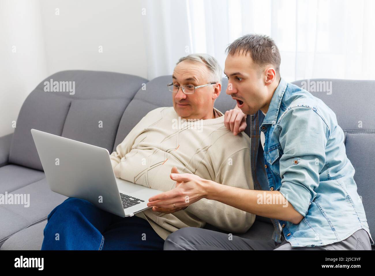 Two men chatting in the living room hi-res stock photography and images ...