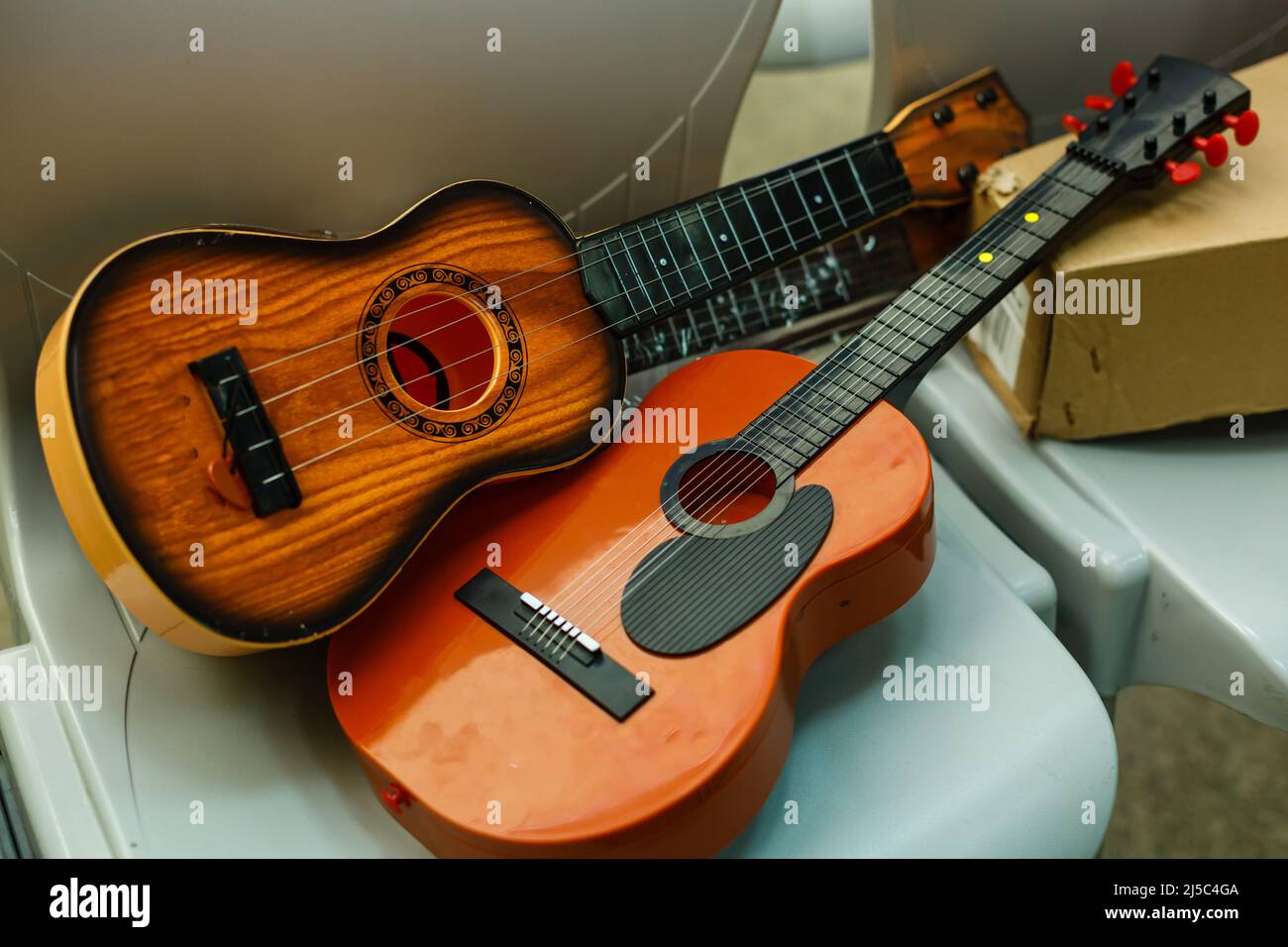 two guitars lie before the concert Stock Photo - Alamy