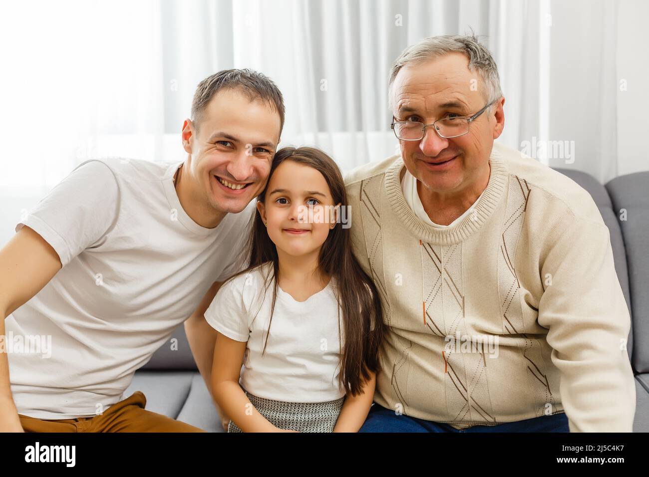Three generation family portrait Stock Photo - Alamy