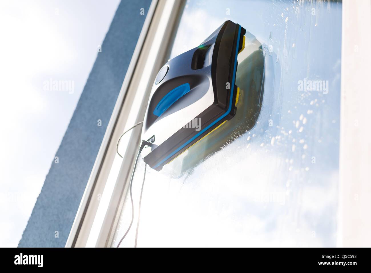 Detail of a glass cleaning robots acting behind a window Stock Photo ...