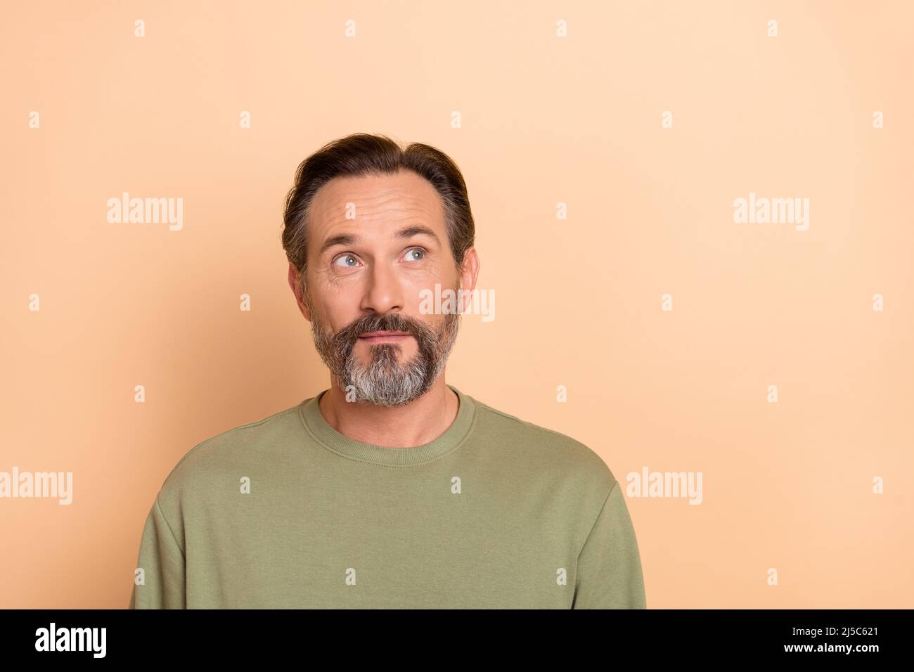 Photo of minded calm person look interested empty space isolated on ...