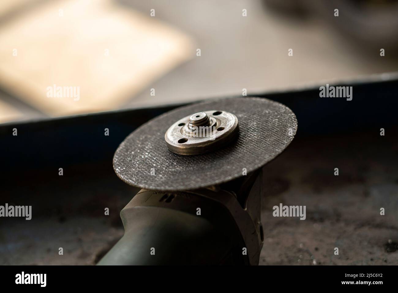 Detail of angle grinder with cutting disc in a workshop Stock Photo - Alamy