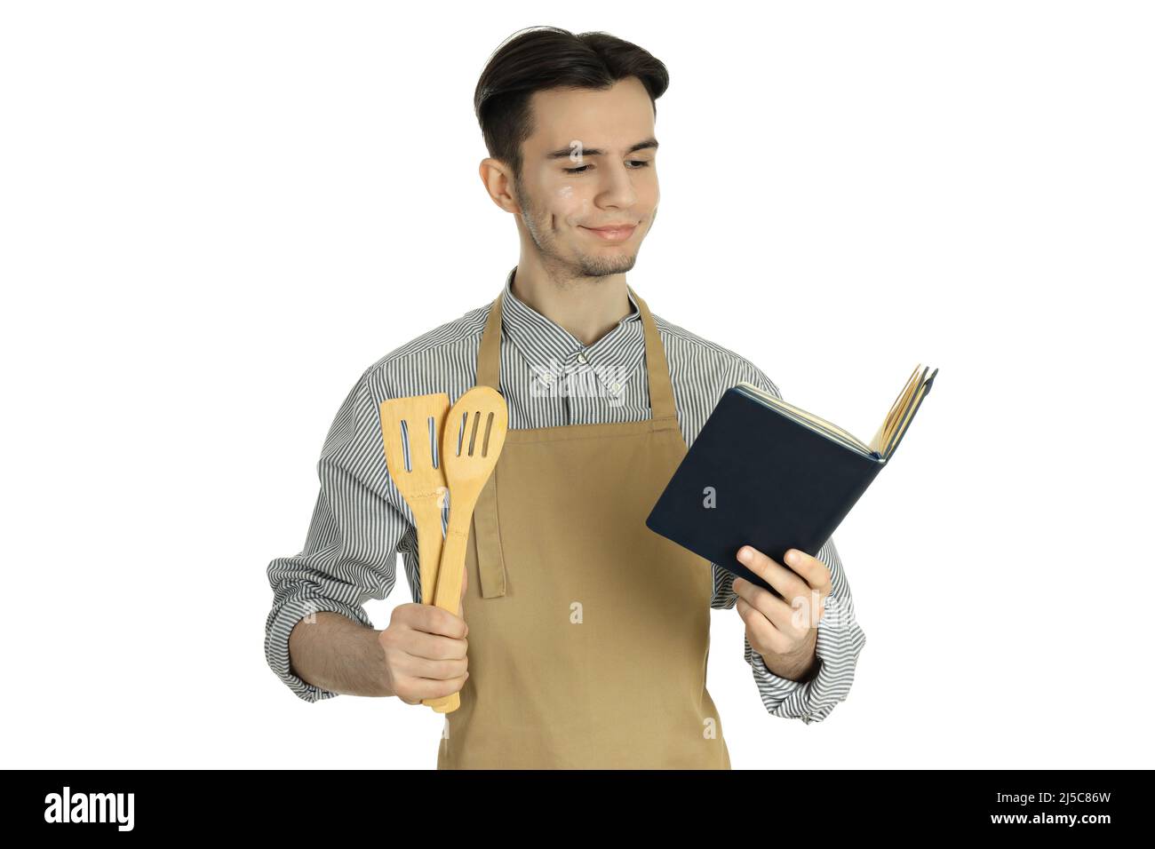 Concept of cooking with young attractive man isolated on white ...