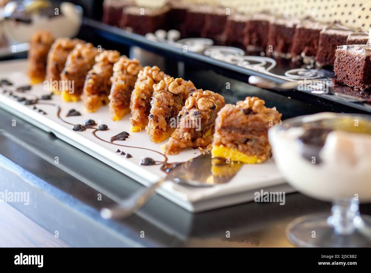 Caramel apple pie with walnuts. Dessert table in a Turkish hotel ...