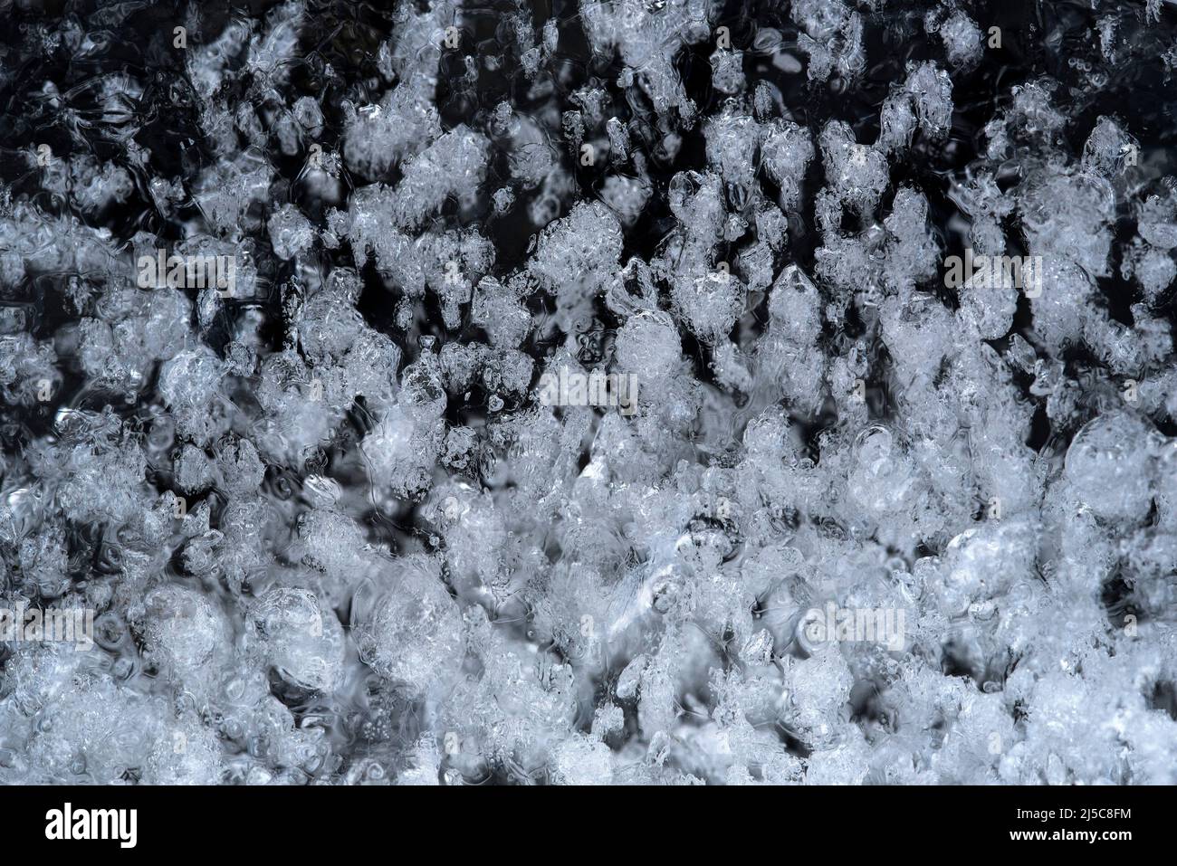 Gas bubbles trapped in ice. Black and white / monochrome image for ...