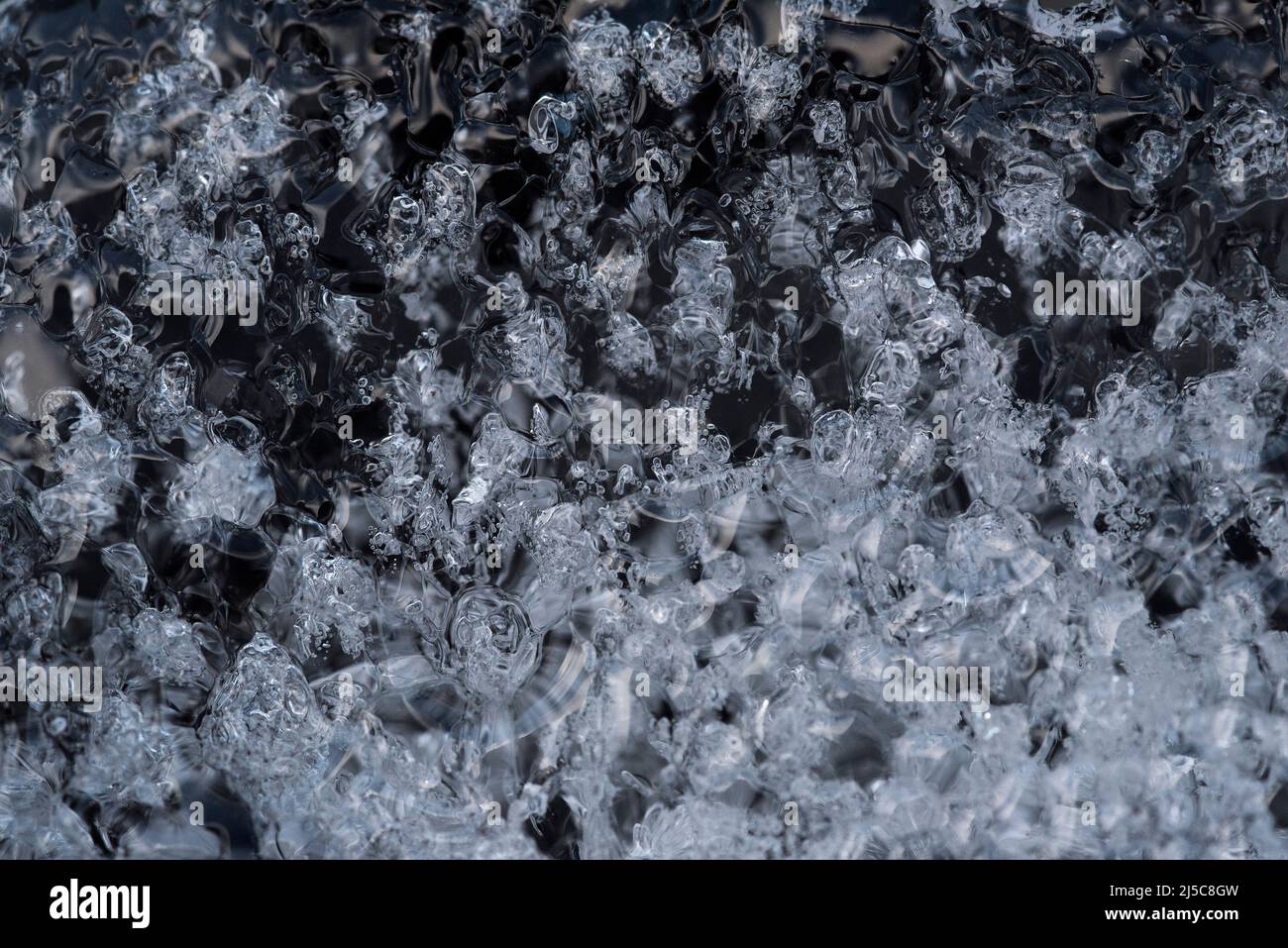 Gas bubbles trapped in ice. Black and white / monochrome image for ...
