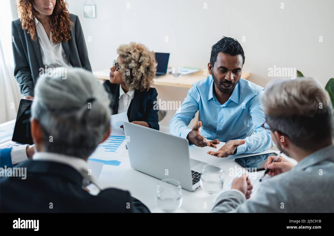 Multiracial business people working together in modern office ...