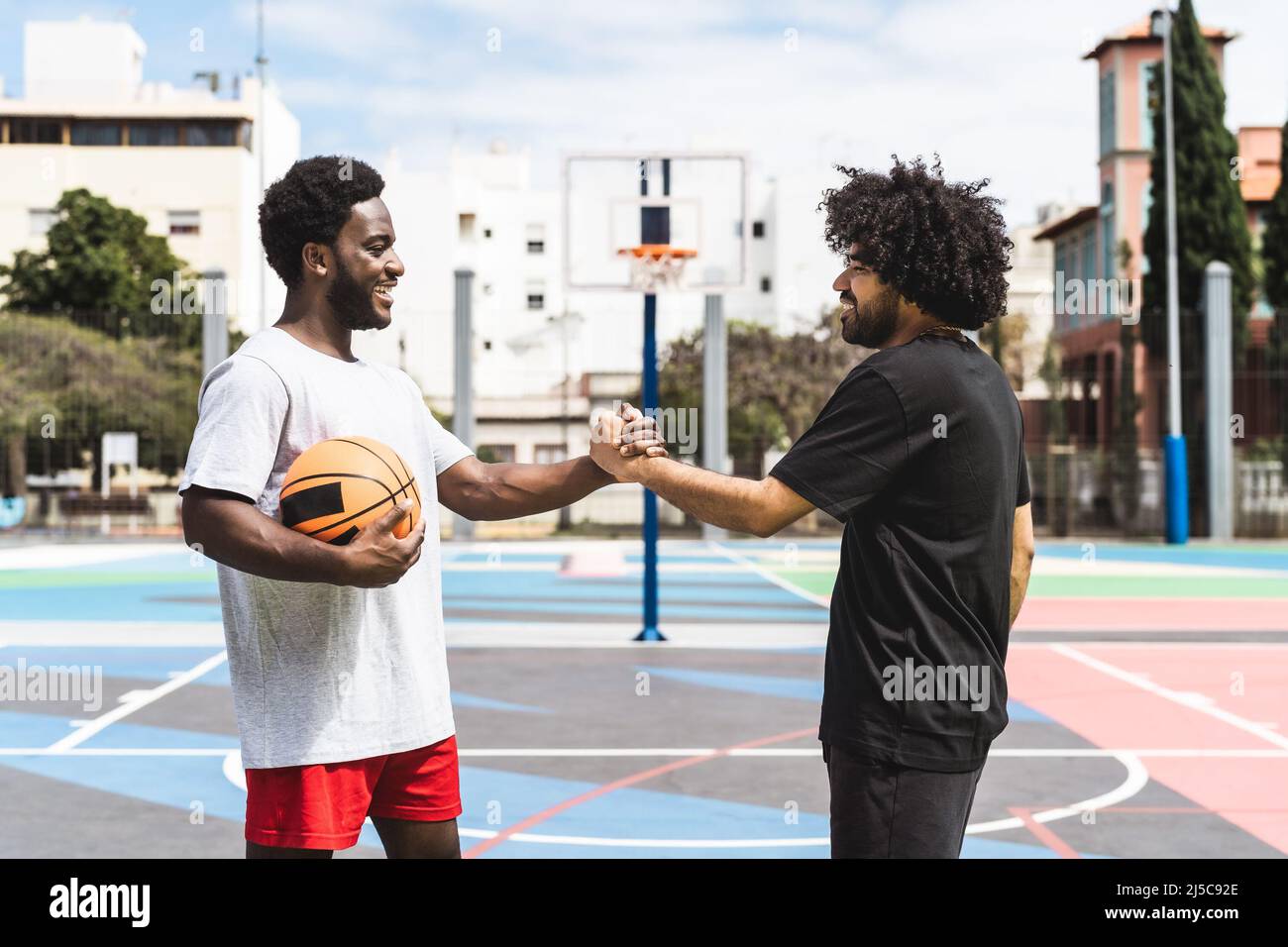 African American friends playing basketball outdoor - Urban sport ...