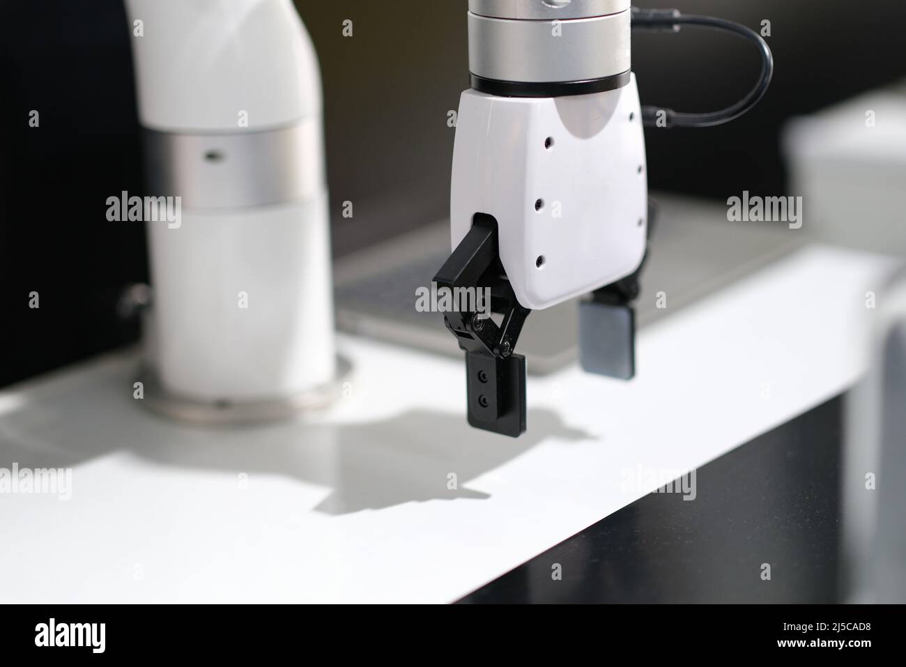 Mechanical arm of robotic arm in production closeup Stock Photo - Alamy