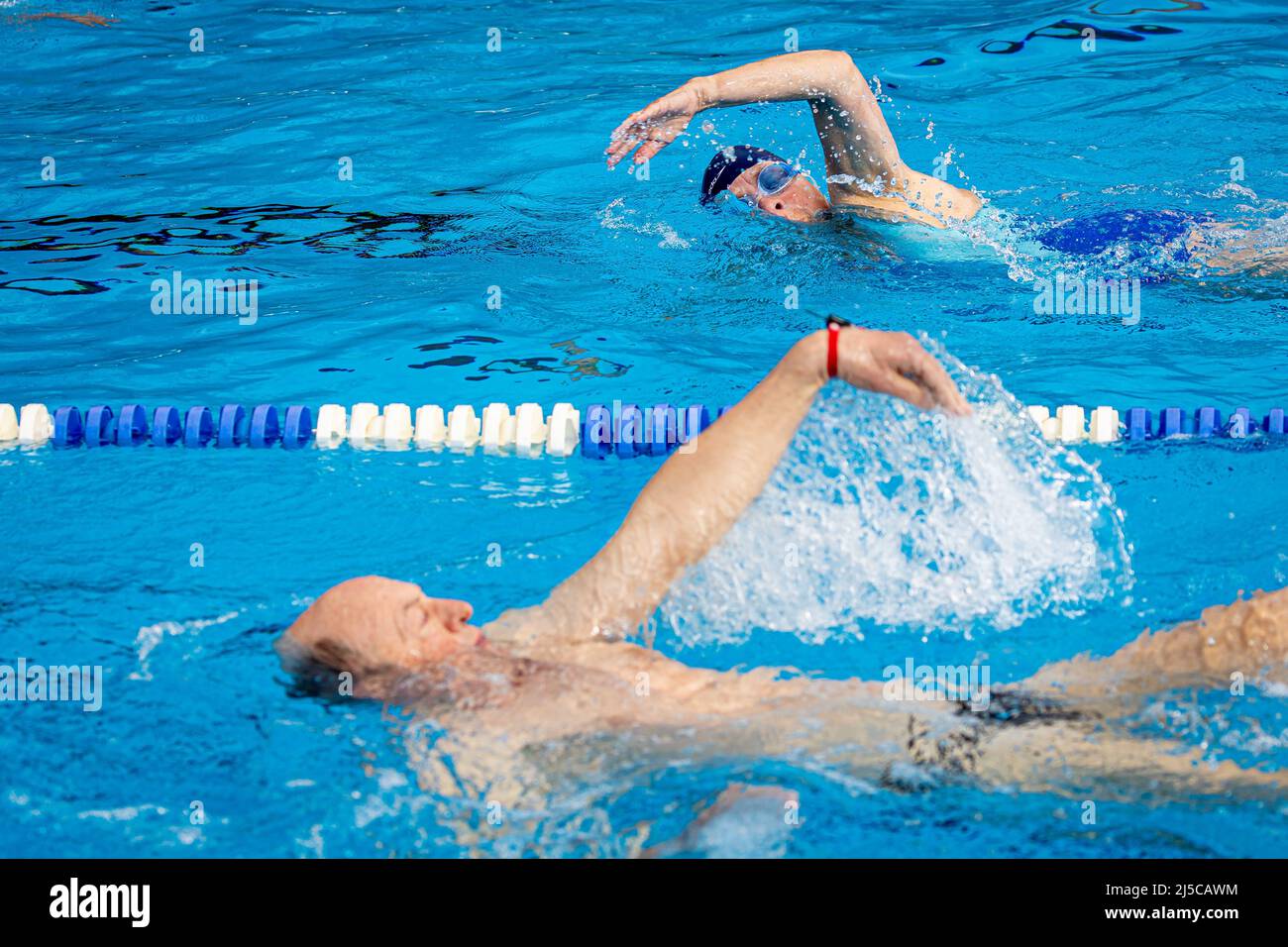 Hanover, Germany. 22nd Apr, 2022. Bathers swim in the pool of the ...