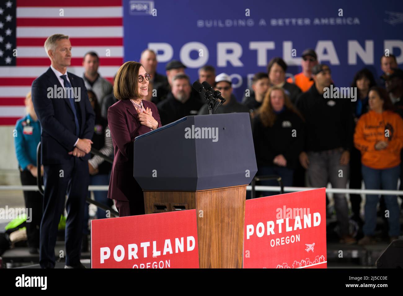 Oregon Governor Kate Brown gives a speech in an Air Force Hangar near ...