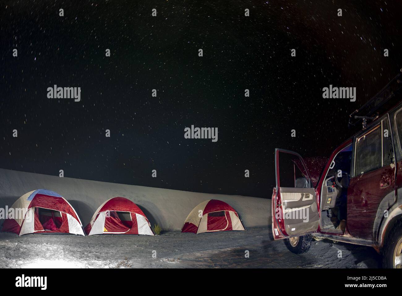 night tent camp with star trail on sandy beach of baja california sur ...