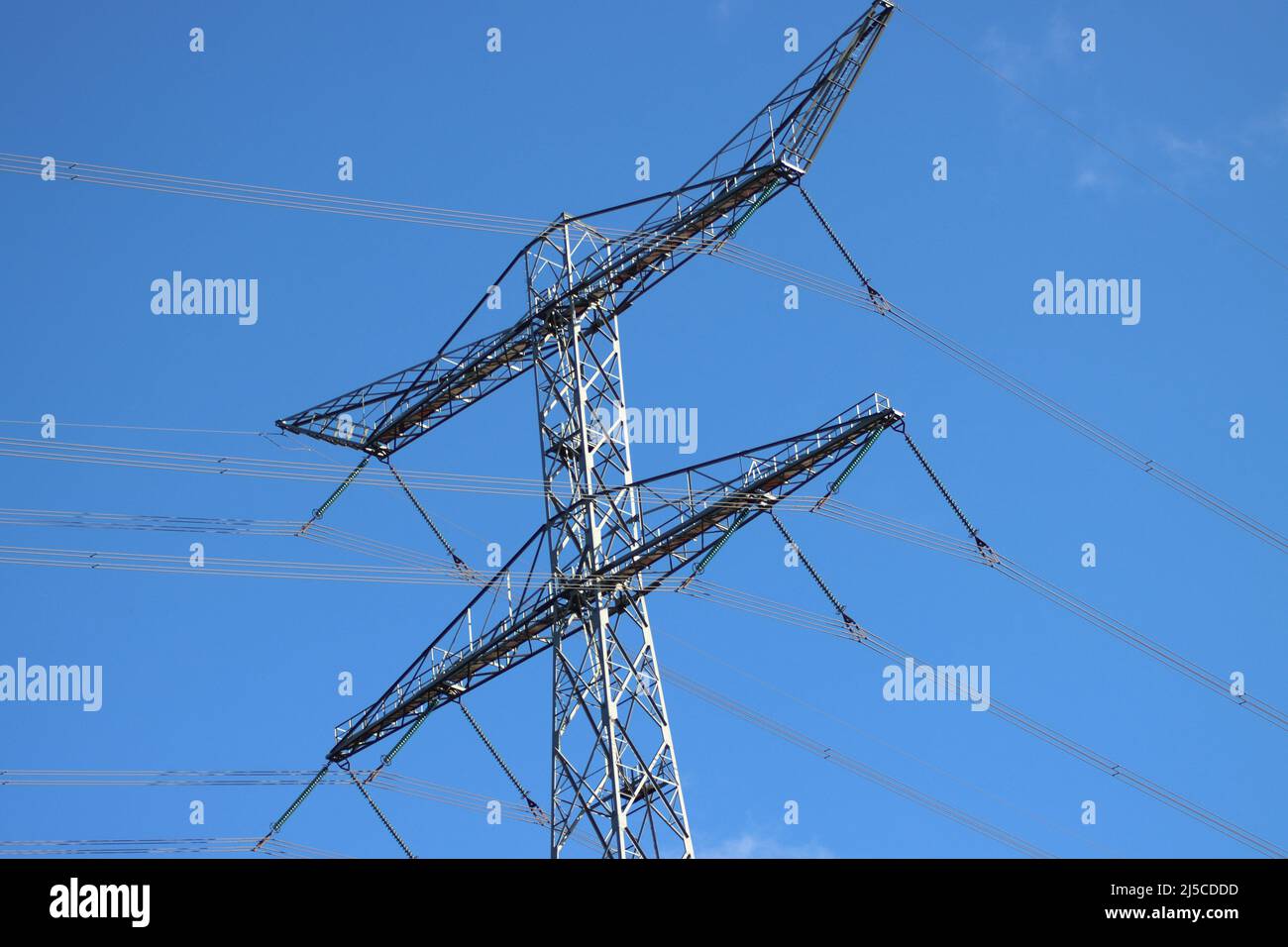 High steel pylons for high voltage power transmission Stock Photo - Alamy