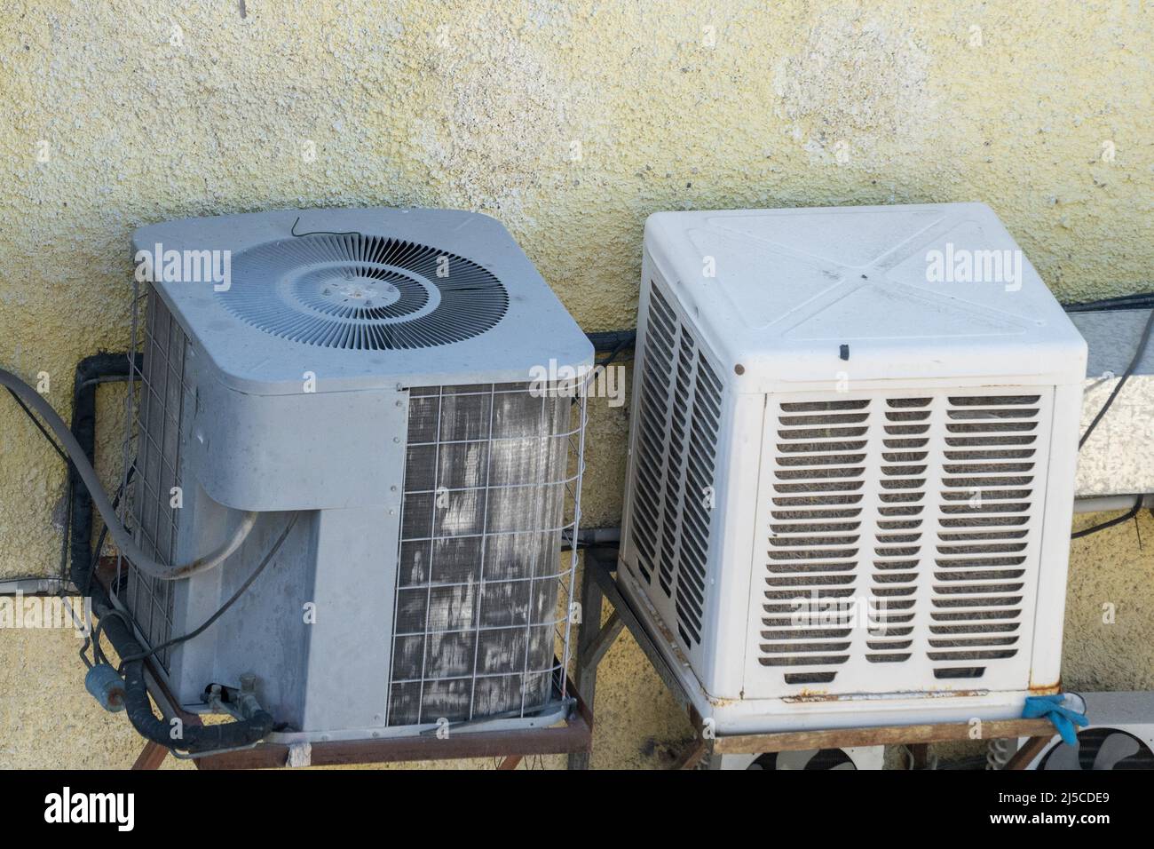 old ac outside building window detail Stock Photo - Alamy