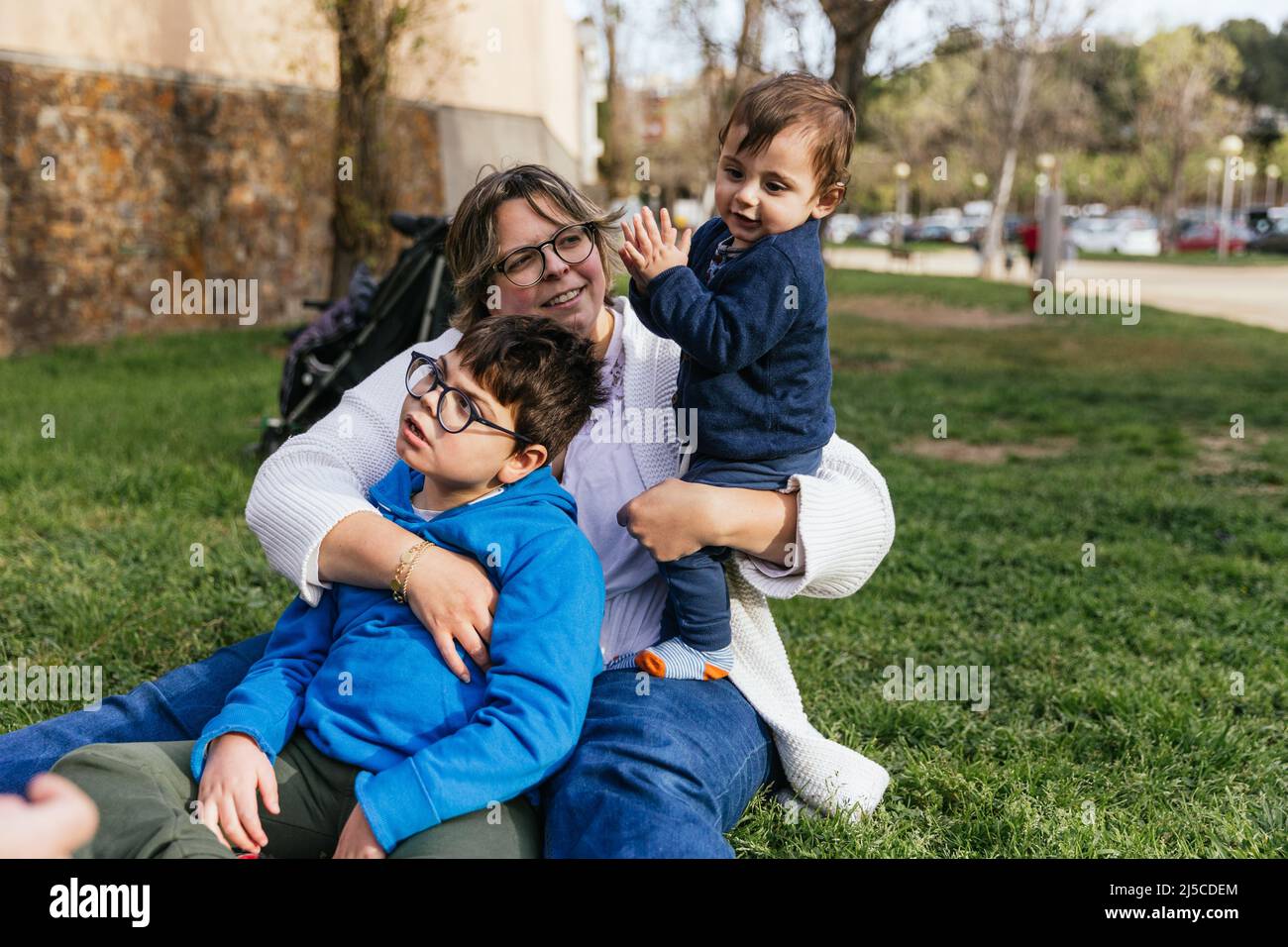A loving mother and her two children spending a day together in the ...