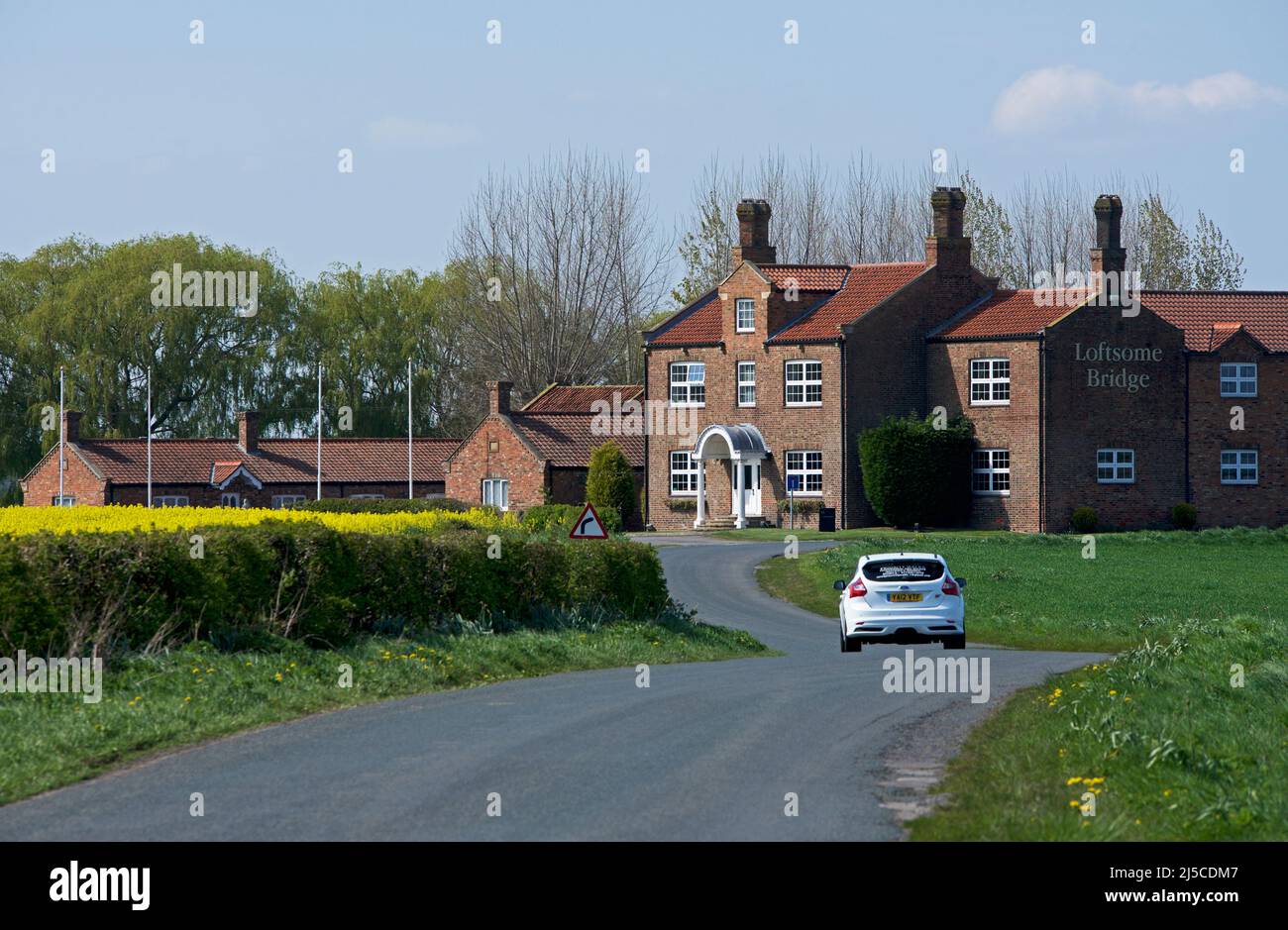 Car passing the Loftsome Bridge Boutique Hotel & Restaurant, Wressle ...