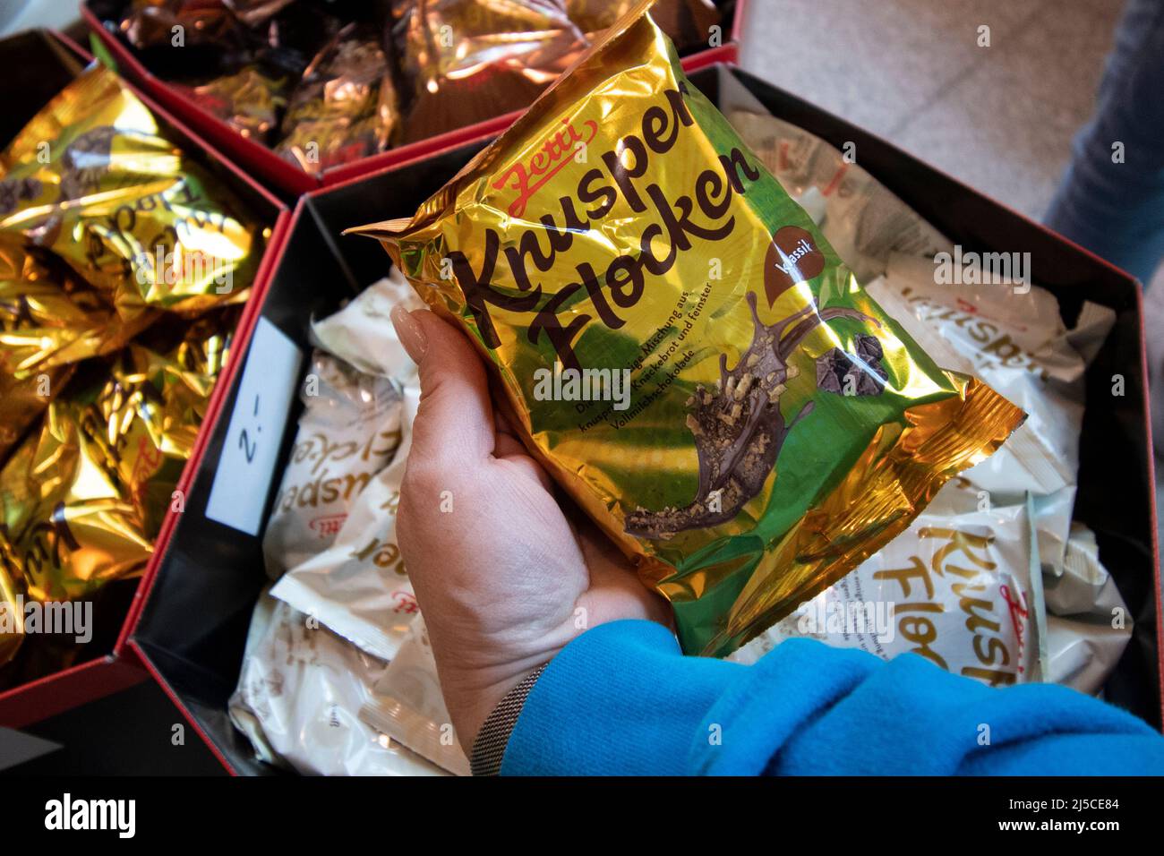 Berlin, Germany. 22nd Apr, 2022. A woman holds a bag with the ...