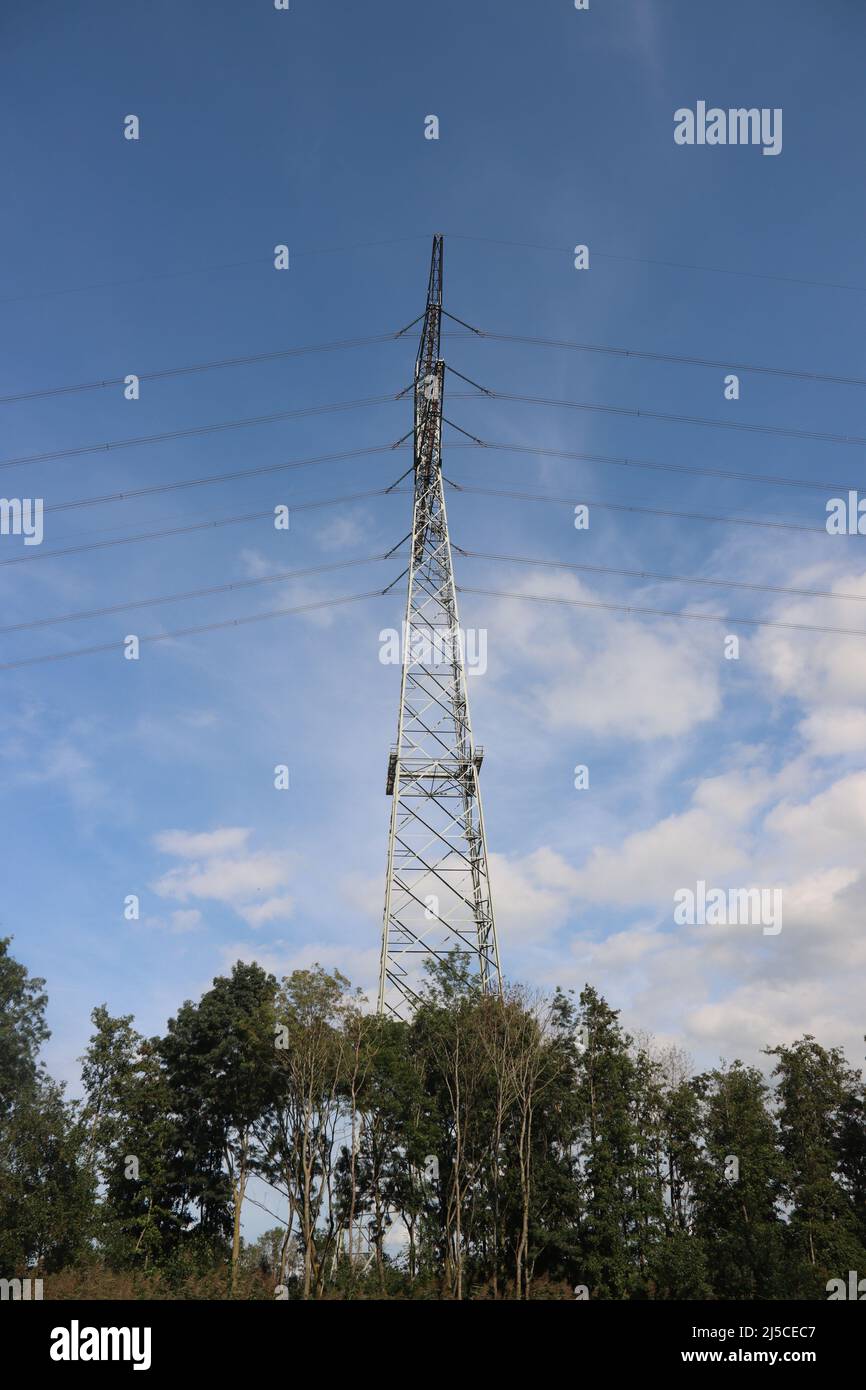 High steel pylons for high voltage power transmission Stock Photo - Alamy