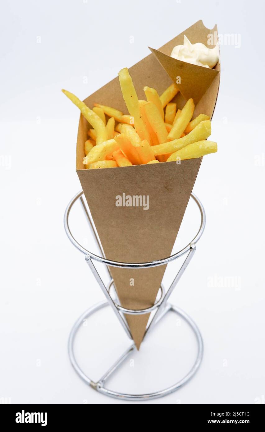 Cone with sweet potatoes and chips to eat and dip in sauce Stock Photo ...