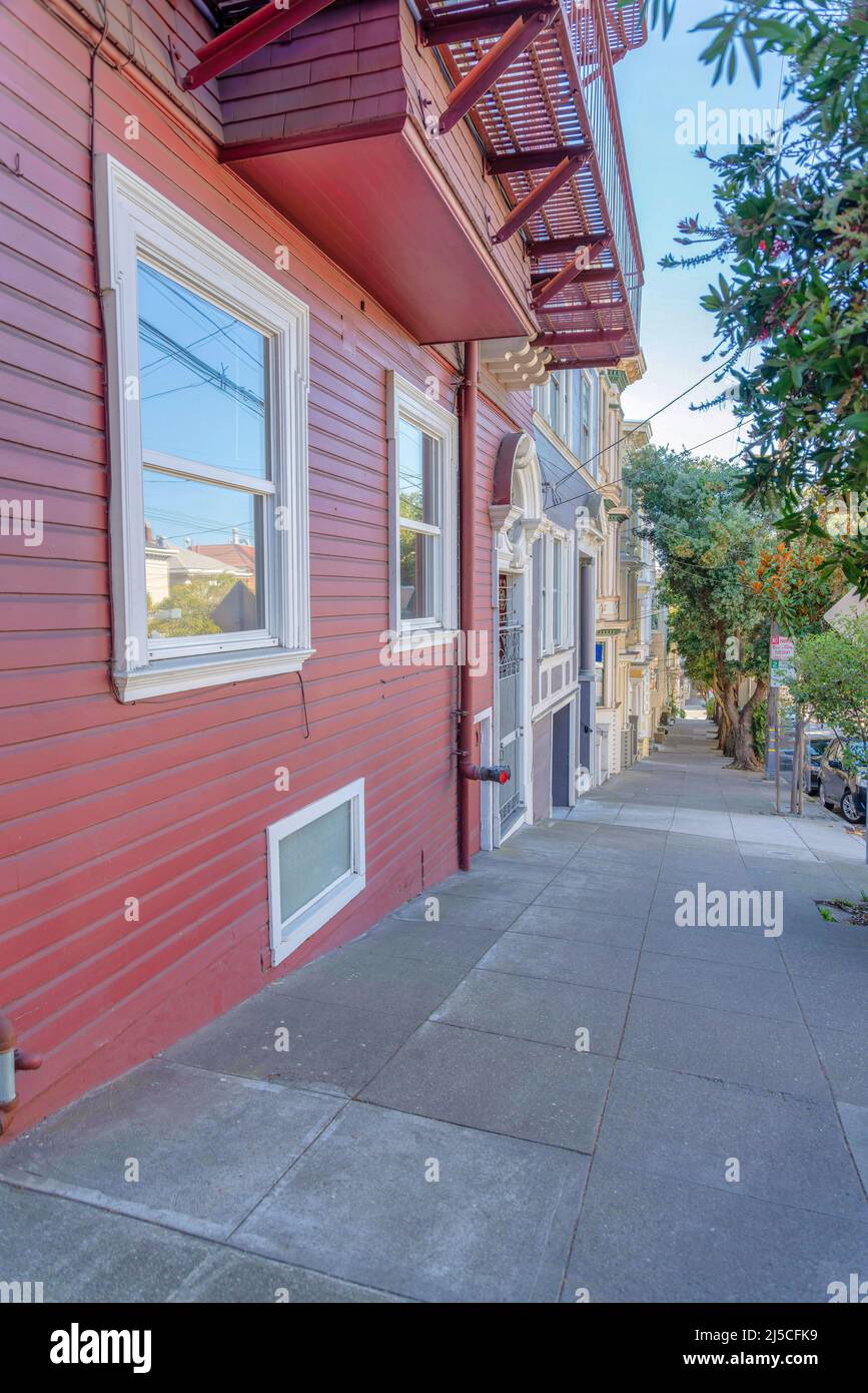Sloped side walk with concrete slab pavement near the residences at San ...