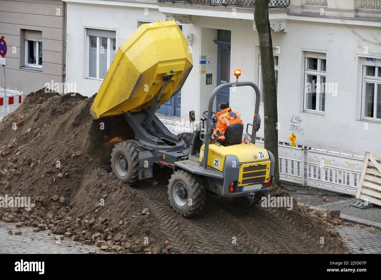 Berlin, DEU, 23.02.2021 - Construction site tipper in operation at a ...