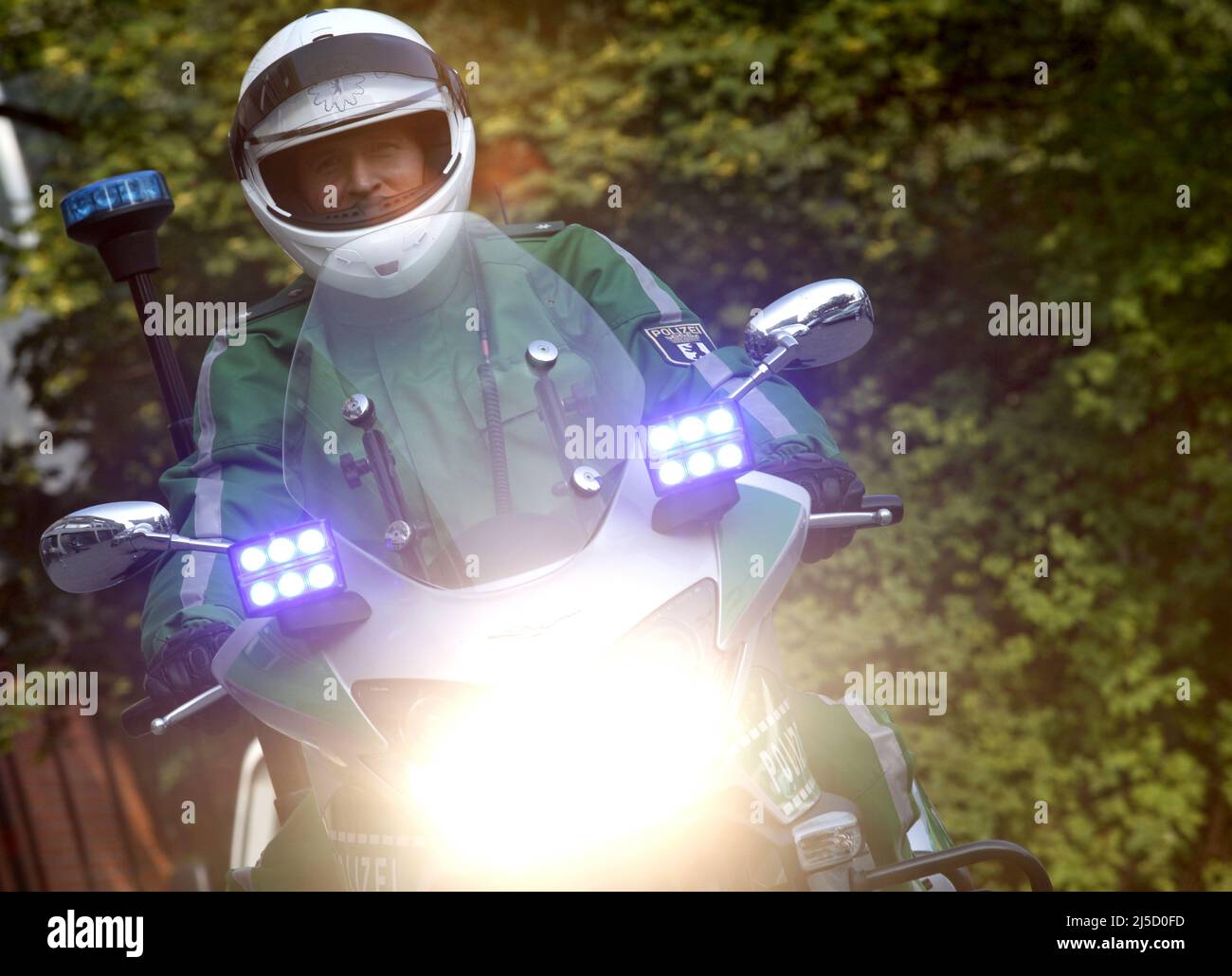 16.09.2009 - Berlin police officer driving police motorcycle with blue ...