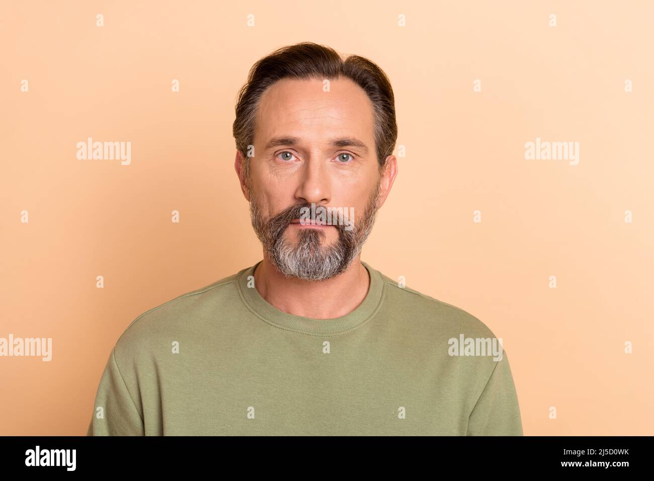 Photo of intelligent calm person look camera nice stubble isolated on ...