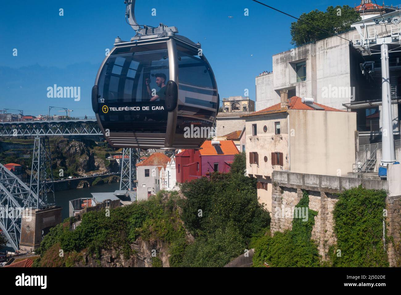 06/14/2018, Porto, Portugal, Europe - A tourist floats in a gondola of ...