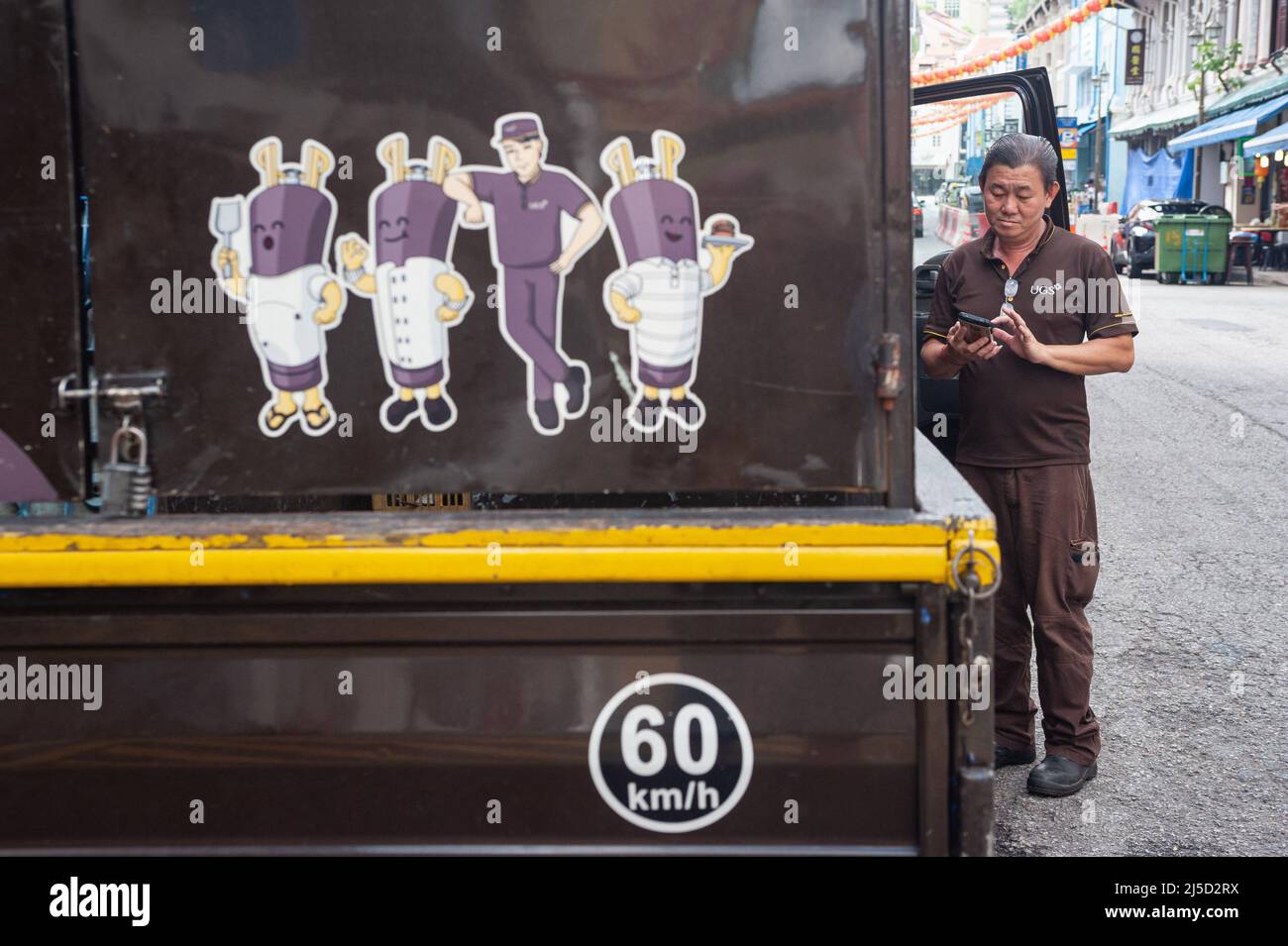 04/18/2018, Singapore, Republic of Singapore, Asia - A delivery driver ...