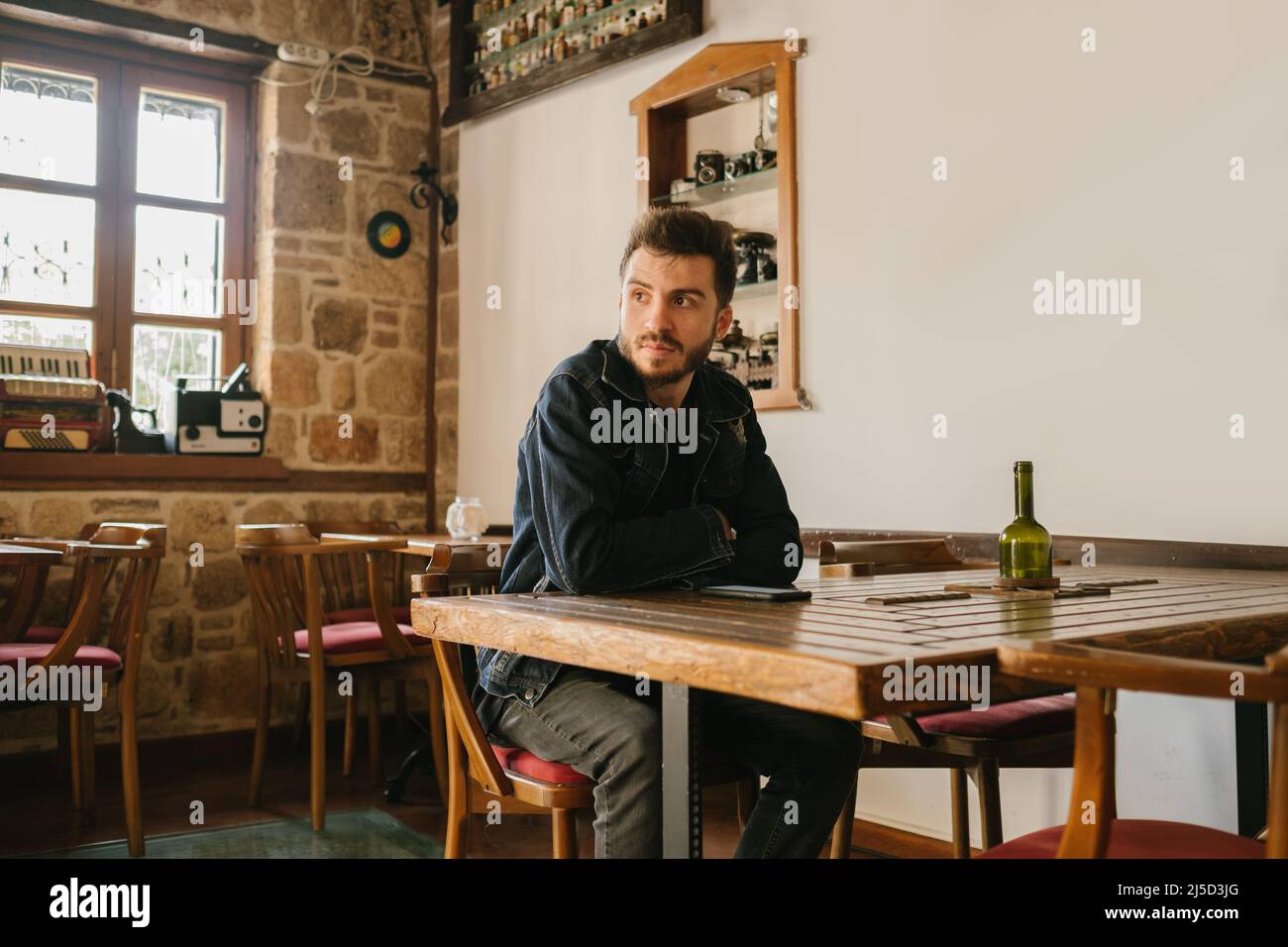 Worried man sitting alone outdoors hi-res stock photography and images ...