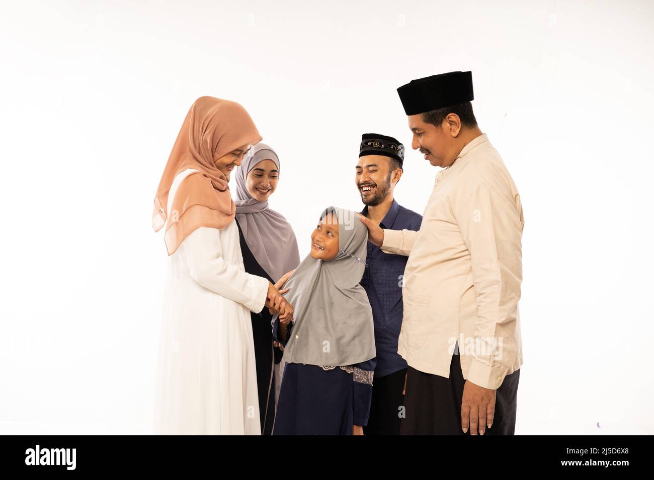 muslim family embracing during family eid mubarak celebration Stock ...