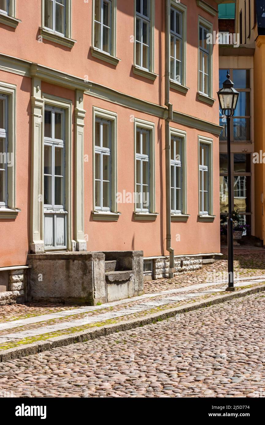 Old beautiful building on a cobblestone street Stock Photo - Alamy