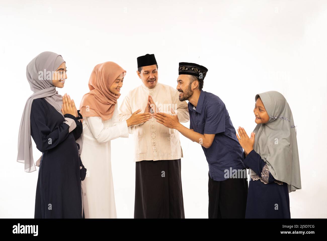 muslim family embracing during family eid mubarak celebration Stock ...