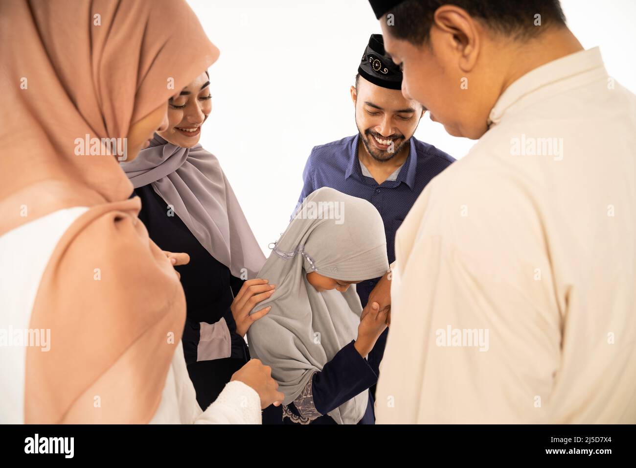 muslim family embracing during family eid mubarak celebration Stock ...