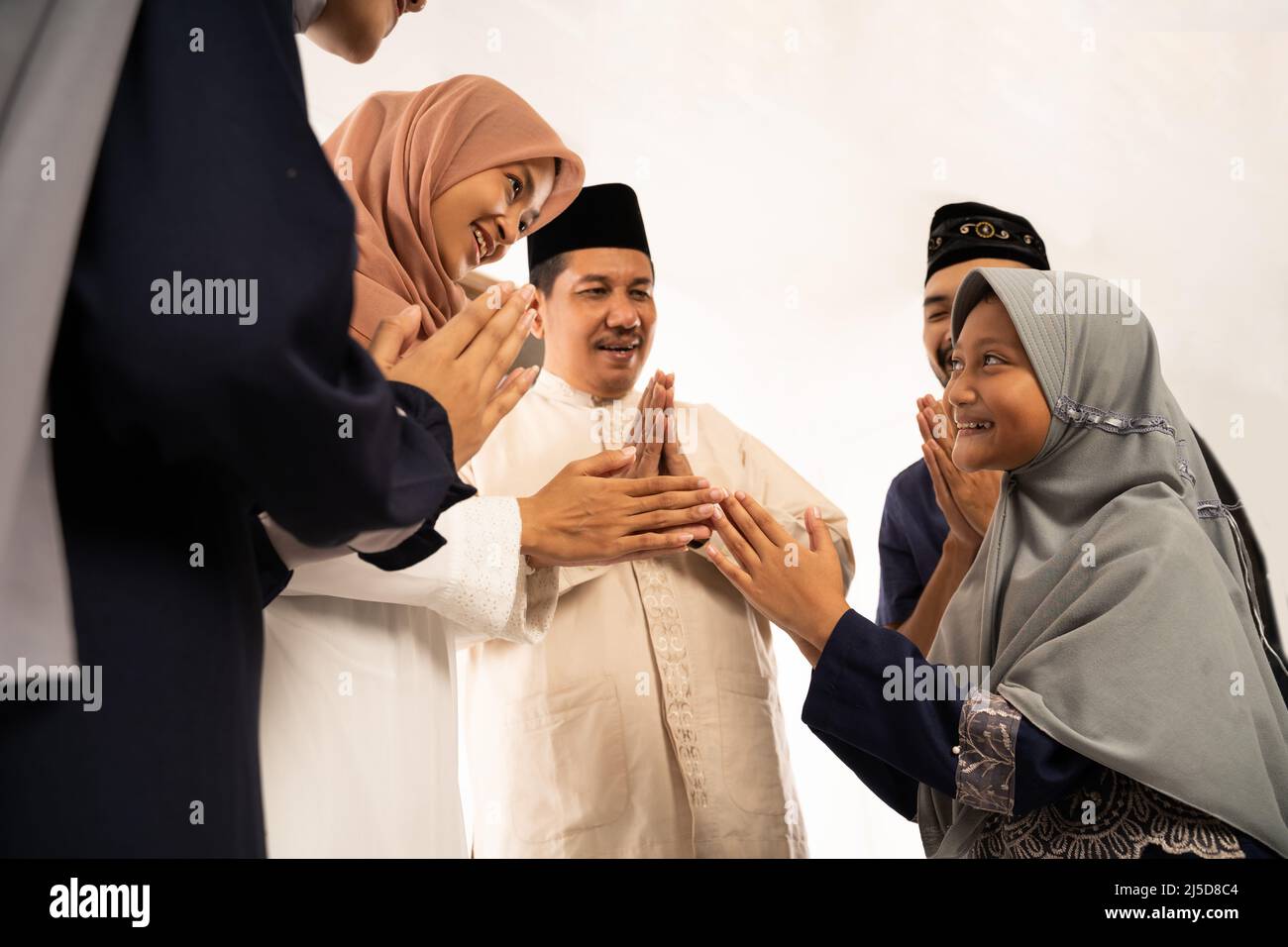 muslim family embracing during family eid mubarak celebration Stock ...
