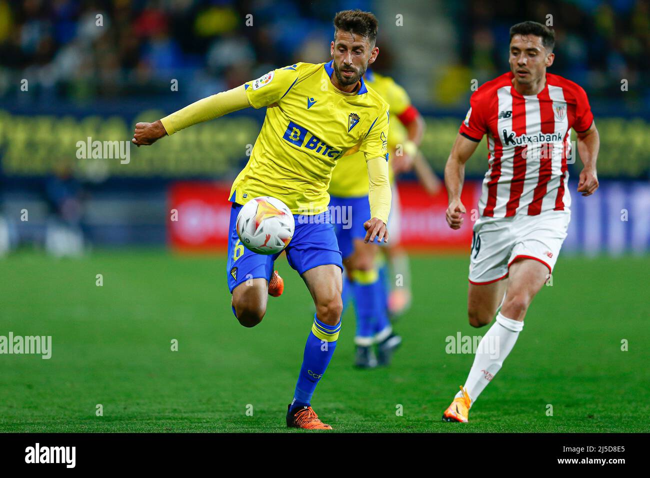 Jose Mari Martin of Cadiz CF and Oier Zarraga of Athletic Club during ...