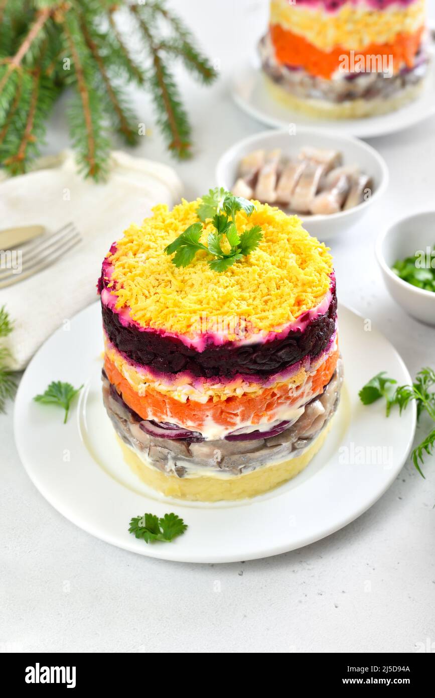 Layered salad with beet, herring, carrots and potatoes. Traditional ...