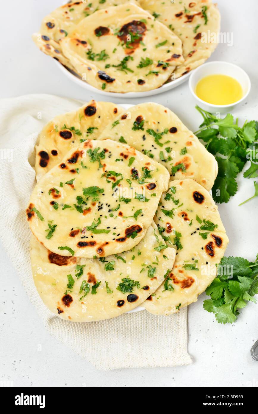 Homemade indian naan bread on light background Stock Photo - Alamy