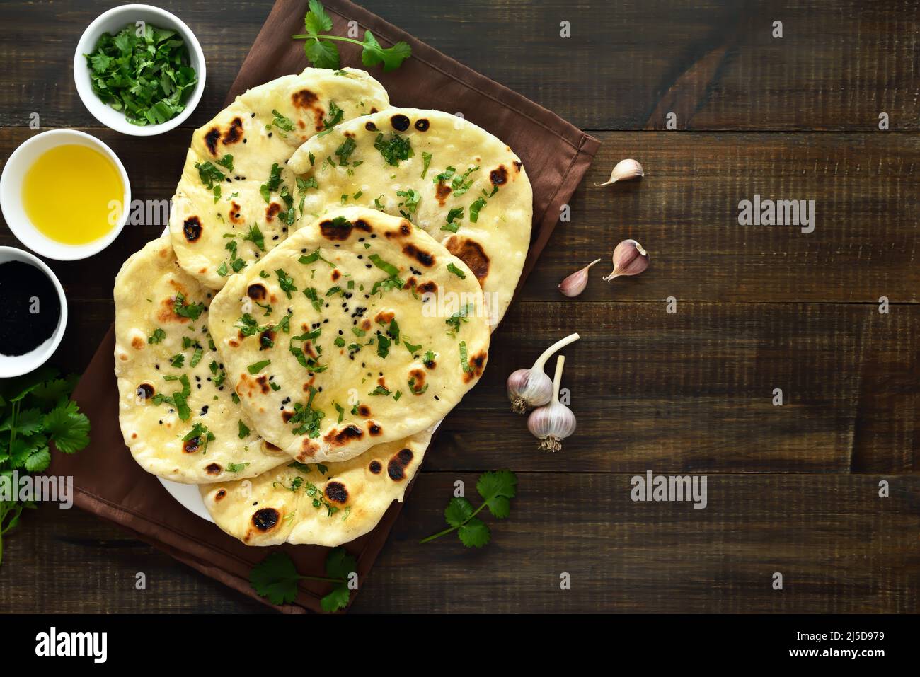 Homemade indian naan bread over wooden background with free text space ...