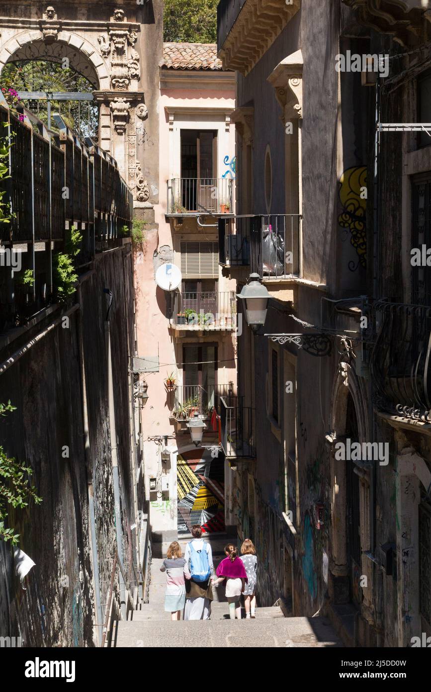 People including a tourist family descend sunken descending flight of ...