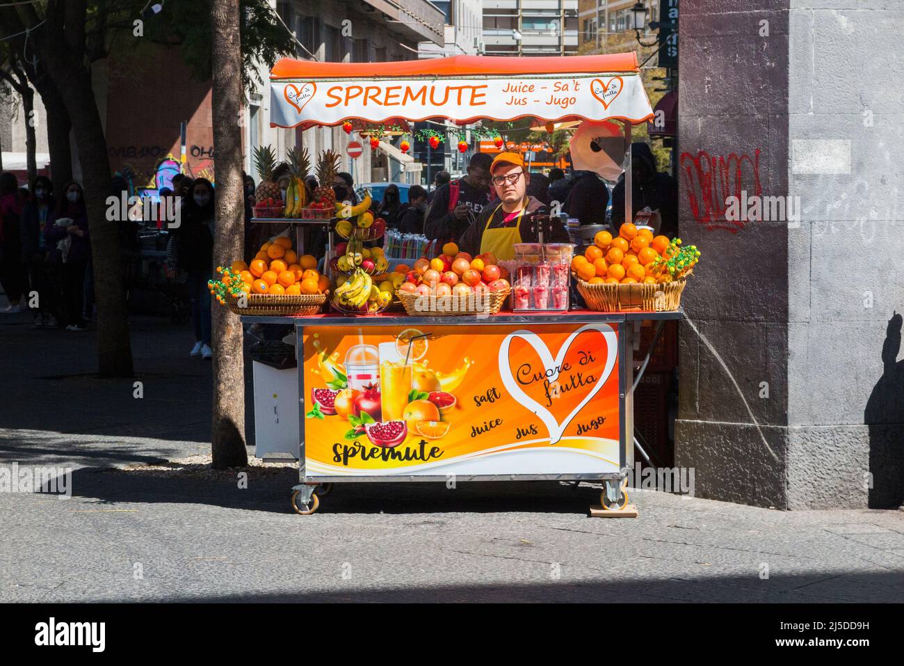 Orange juice seller with fresh squeezed juice, in the street in Catania ...