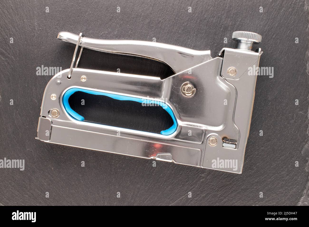 One metal stapler on a slate stone, macro, top view Stock Photo - Alamy