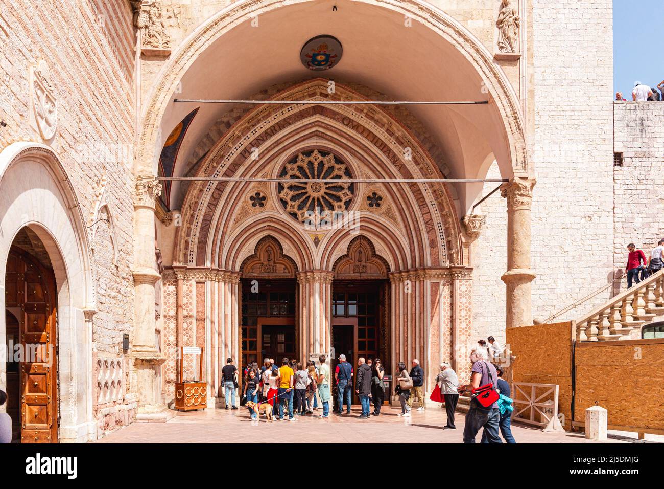 Side entrance of the lower Basilica of San Francesco d'Assisi, Umbria ...